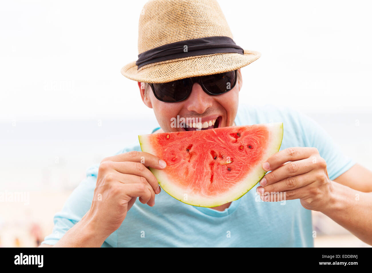 Young man hat watermelon hi-res stock photography and images - Alamy