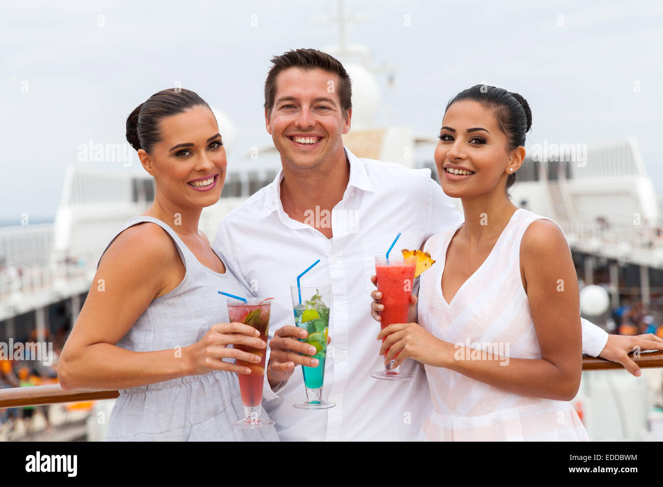 group of friends drinking cocktails on cruise ship Stock Photo - Alamy