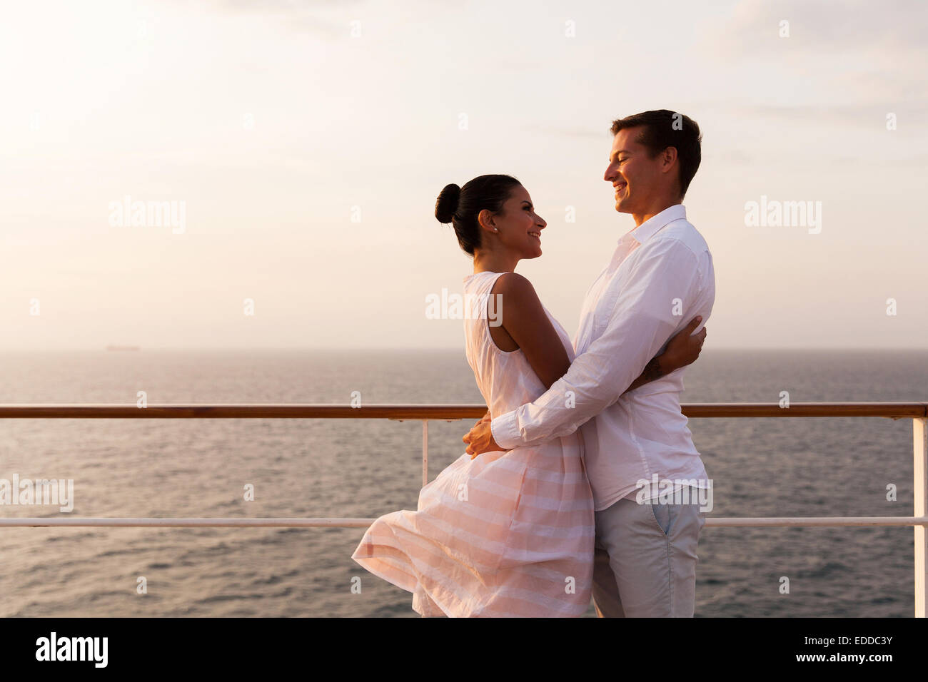 romantic couple embracing on cruise ship at sunset Stock Photo - Alamy