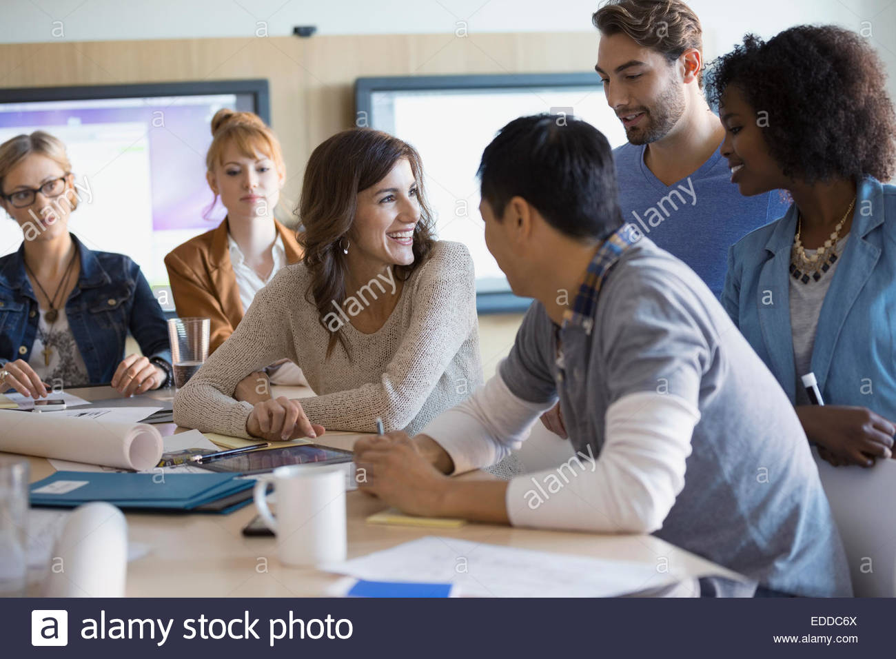 Smiling business people in meeting Stock Photo - Alamy