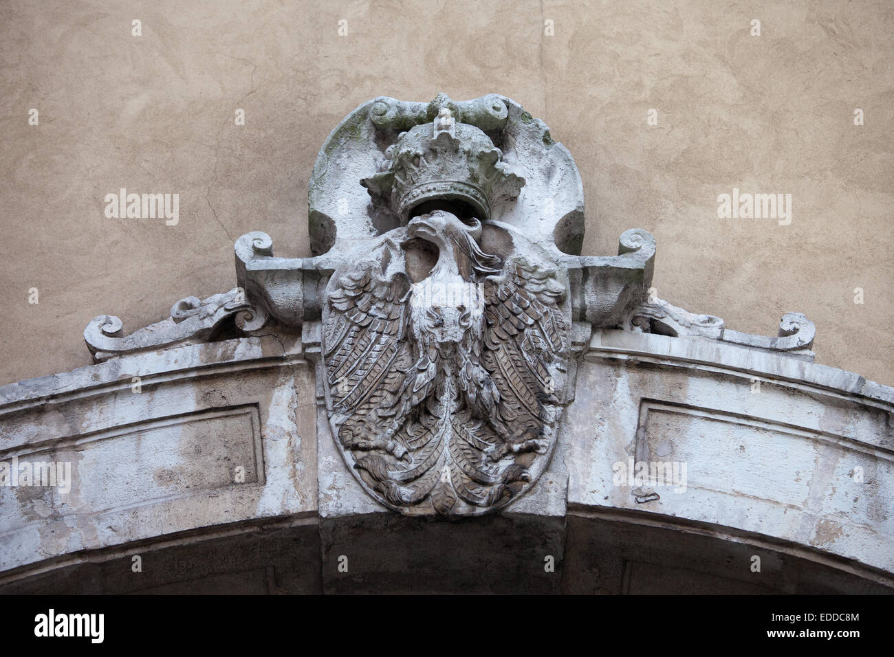 Eagle with crown, Coat of arms of Poland stone carving above entrance ...