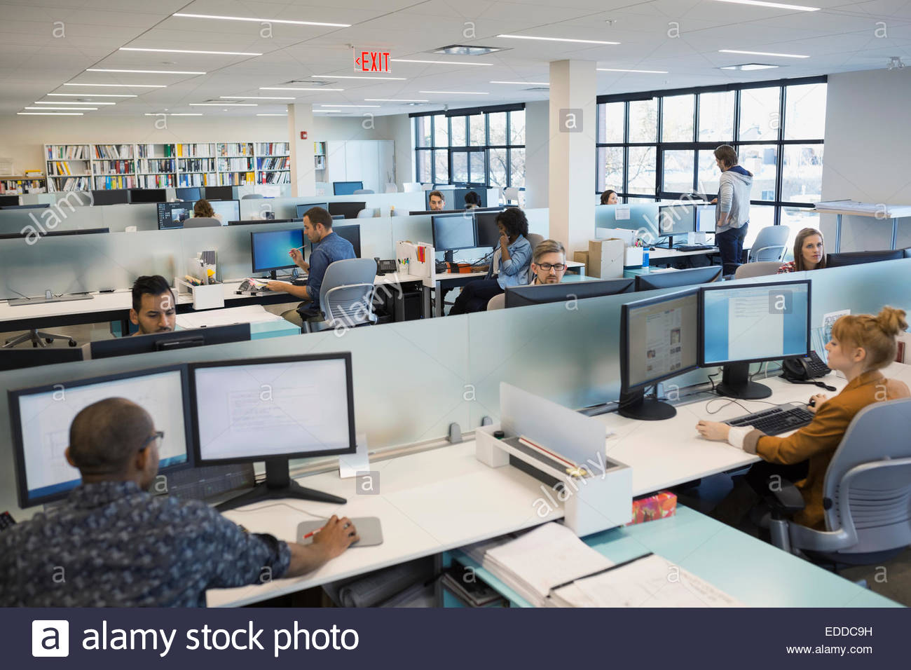 Business people working in open office Stock Photo: 77127053 - Alamy