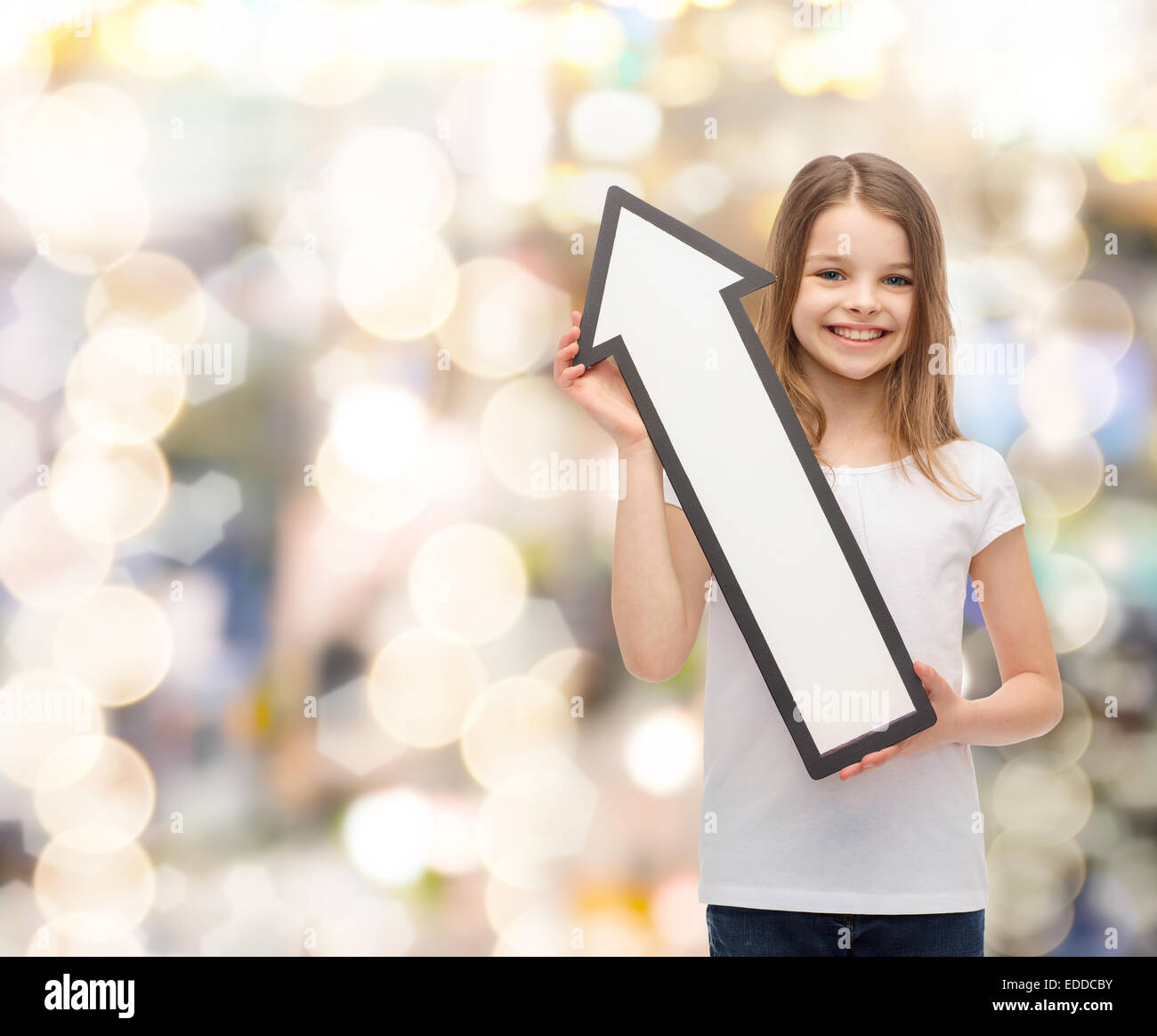 smiling little girl with blank arrow pointing up Stock Photo - Alamy