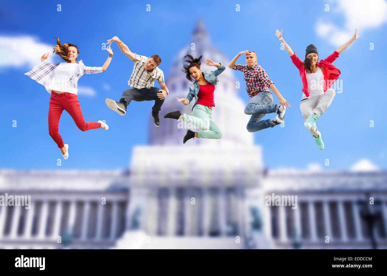 group of teenagers jumping Stock Photo - Alamy