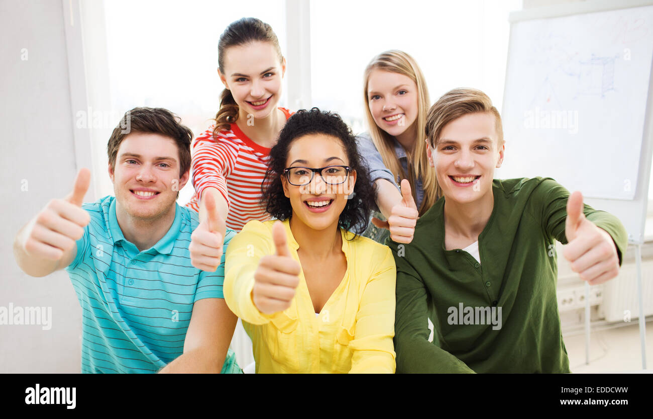 smiling students at school showing thumbs up Stock Photo - Alamy