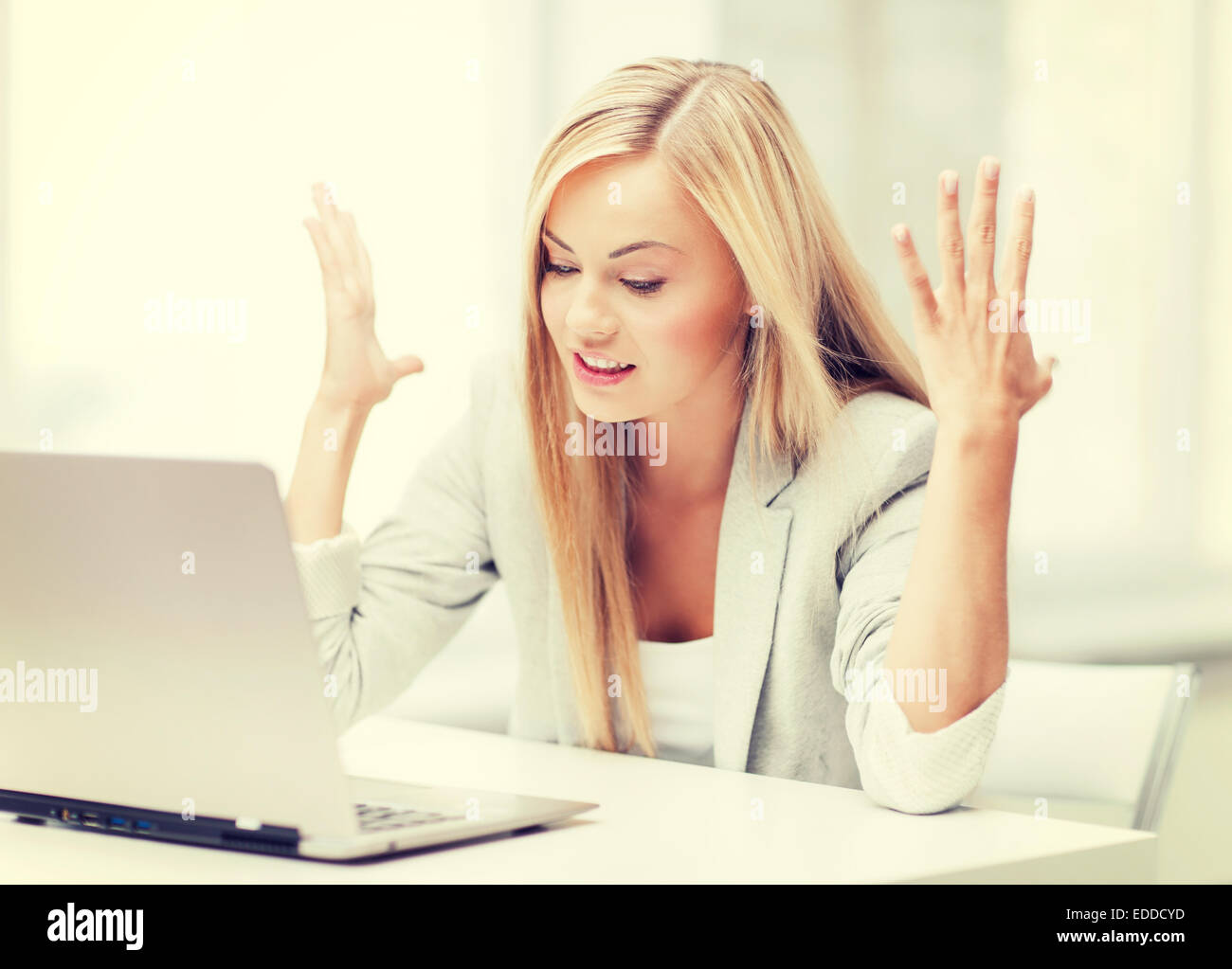 angry woman with laptop Stock Photo - Alamy