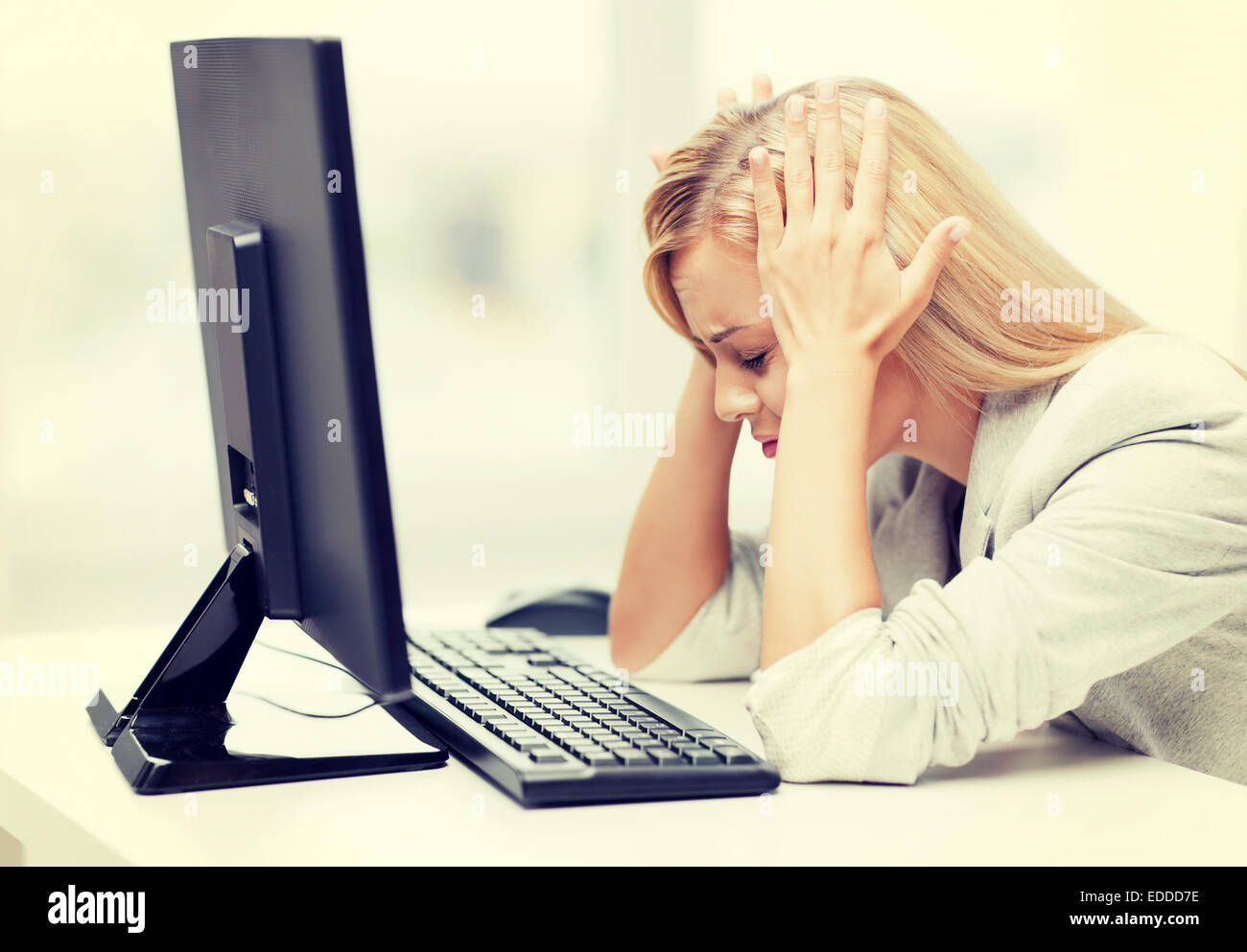 stressed woman with computer Stock Photo - Alamy