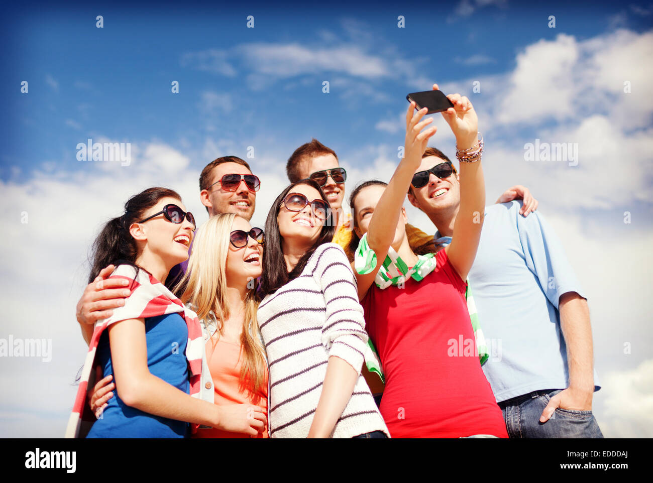 group of friends taking picture with smartphone Stock Photo - Alamy