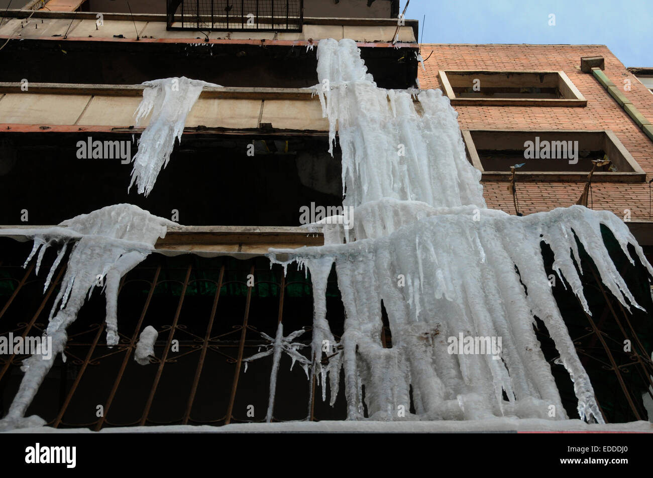 The ice fall appears on a demolition building because of leaking water ...