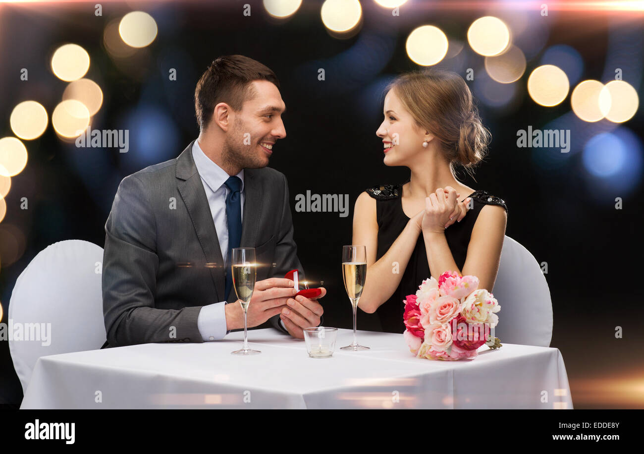 man proposing to his girlfriend at restaurant Stock Photo - Alamy
