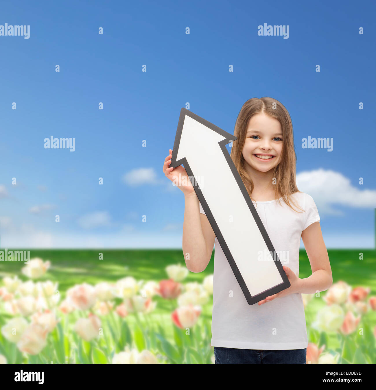 smiling little girl with blank arrow pointing up Stock Photo - Alamy