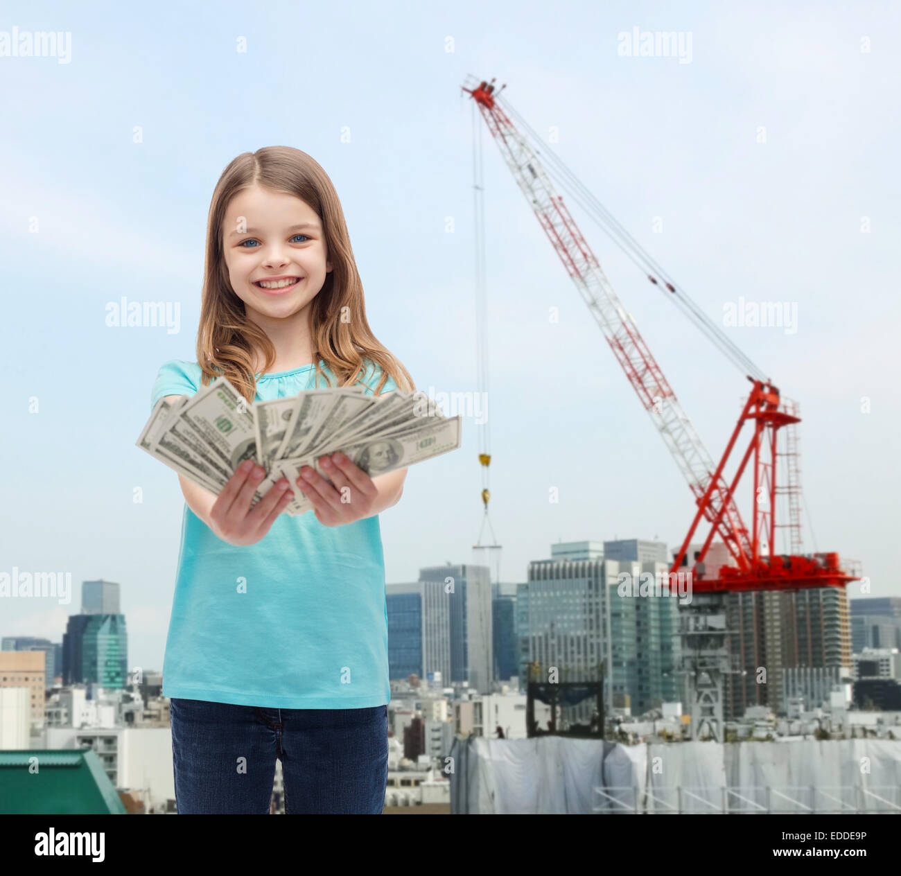 smiling little girl giving dollar cash money Stock Photo - Alamy