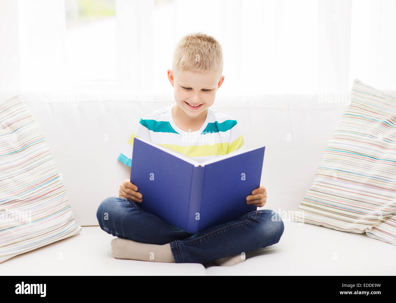 Little boy reading book hi-res stock photography and images - Alamy