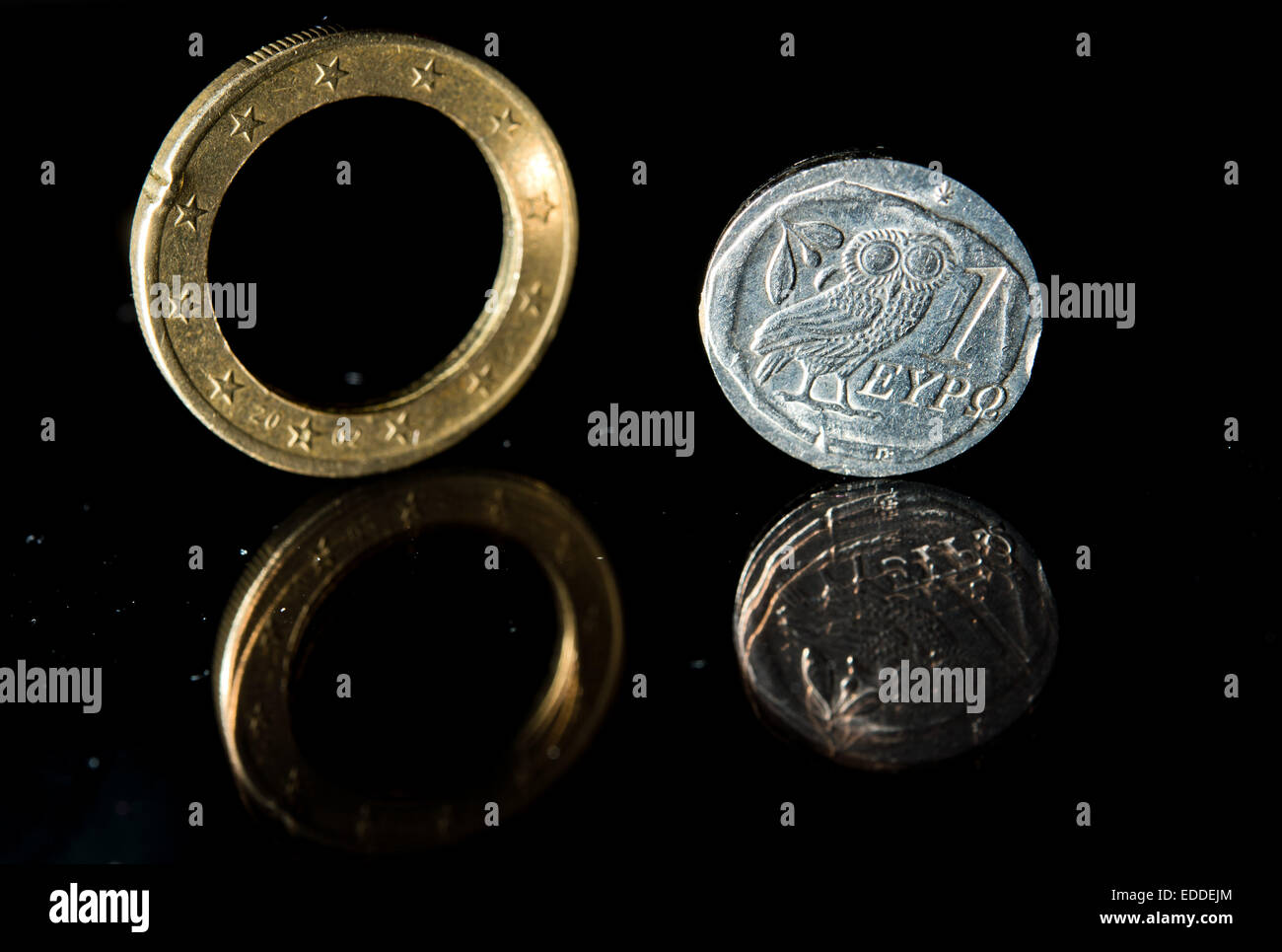 ILLUSTRATION - A Greek euro coin broken in two pieces is on display on ...