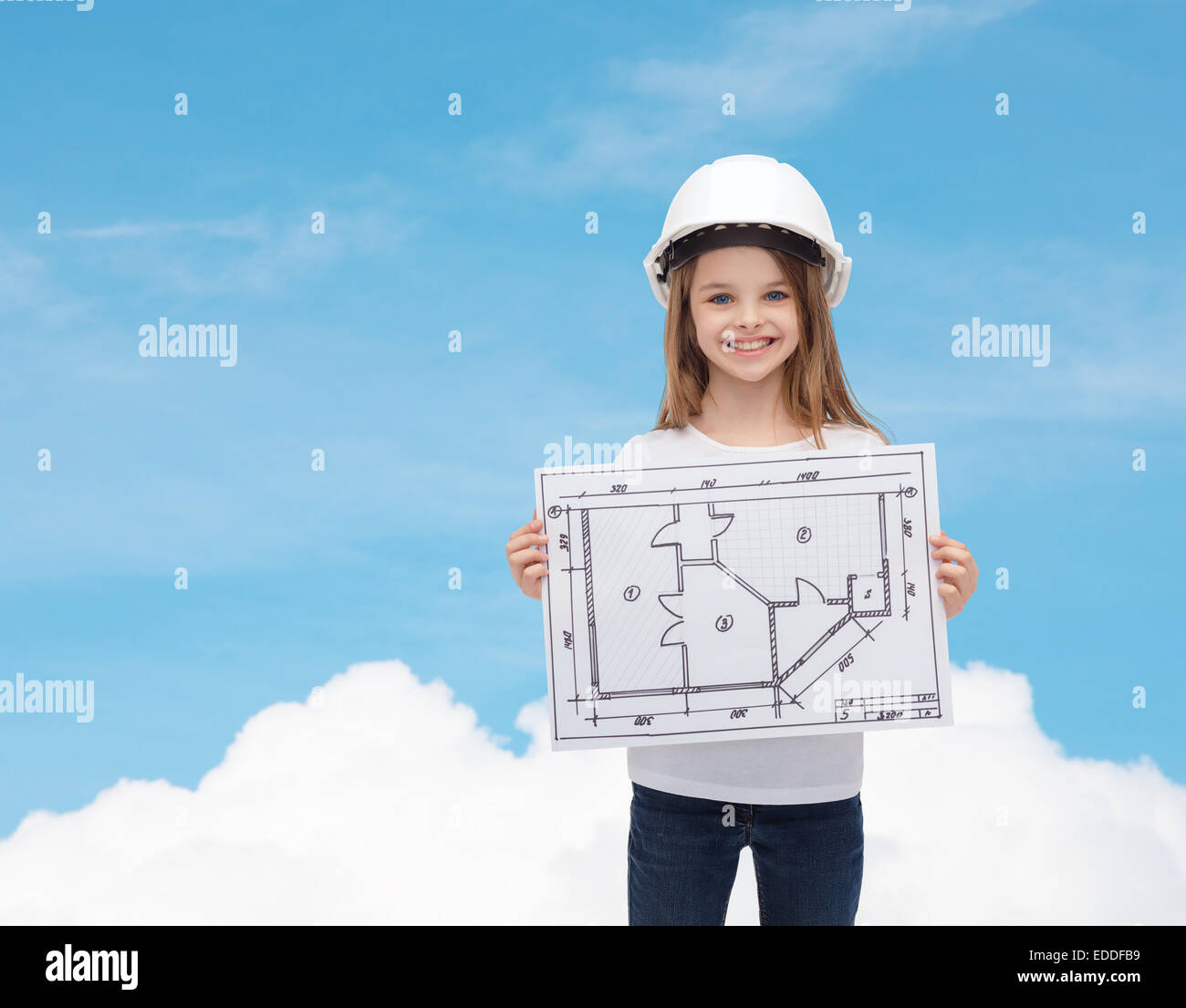 smiling little girl in helmet showing blueprint Stock Photo - Alamy