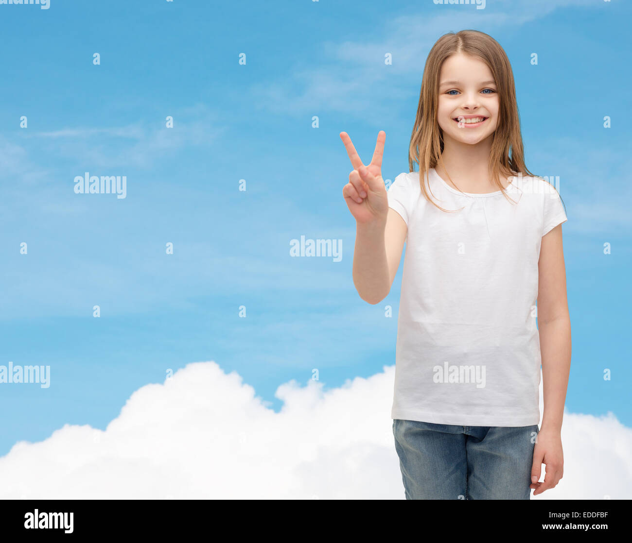 little girl in white t-shirt showing peace gesture Stock Photo - Alamy