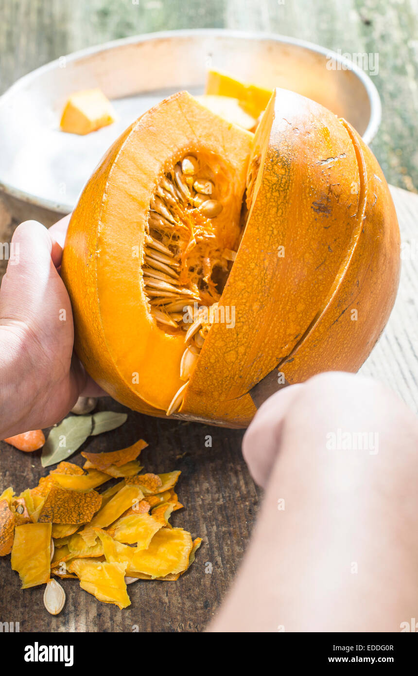 Hand cutting pumpkin Stock Photo - Alamy
