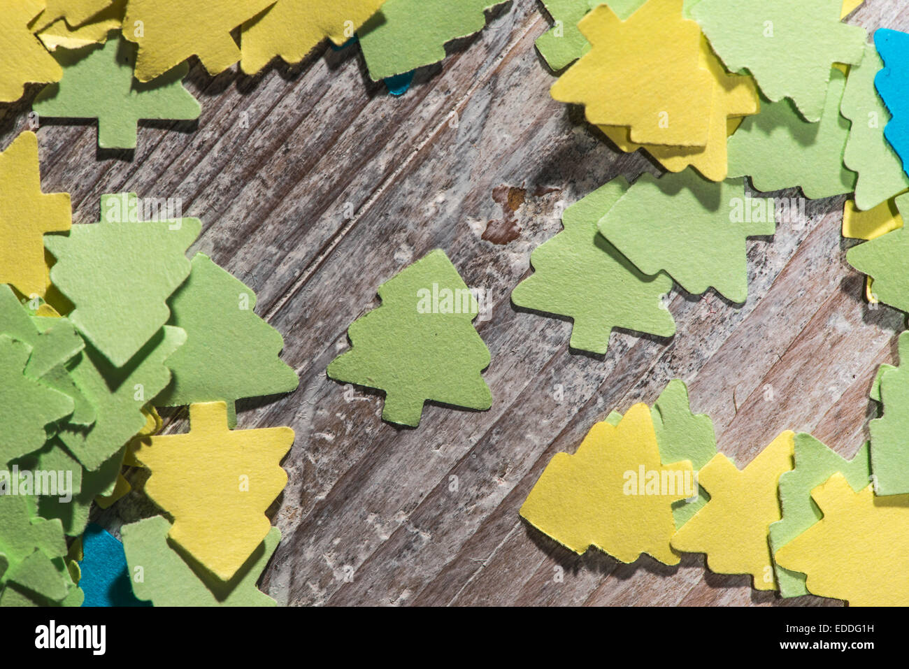 Coloured paper shaped like fir trees on wood Stock Photo - Alamy