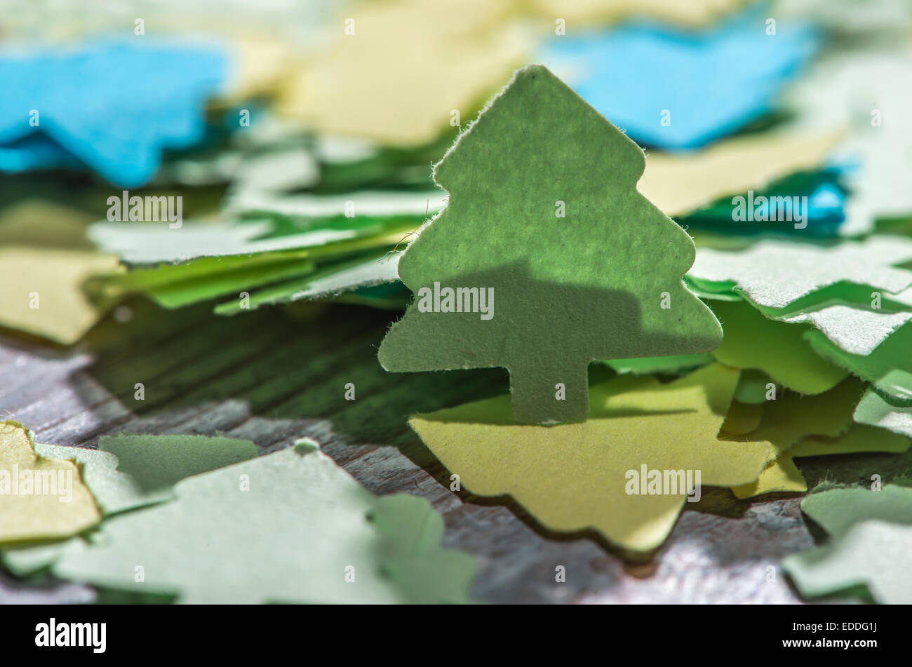 Coloured paper shaped like fir trees on wood Stock Photo - Alamy