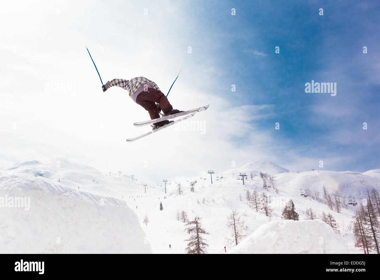 Free style skier performing a high jump Stock Photo - Alamy