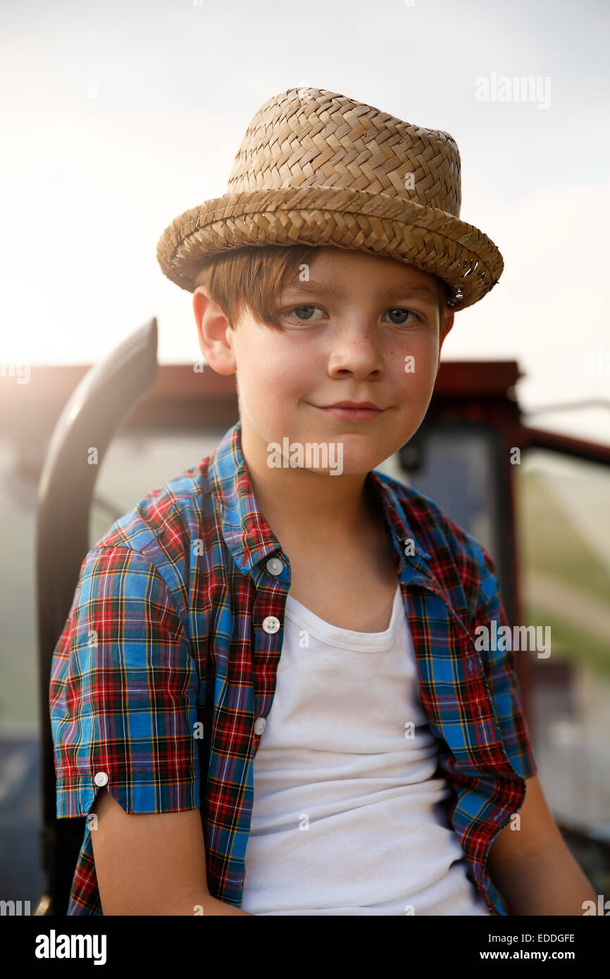 Portrait of smiling little boy wearing straw hat Stock Photo - Alamy