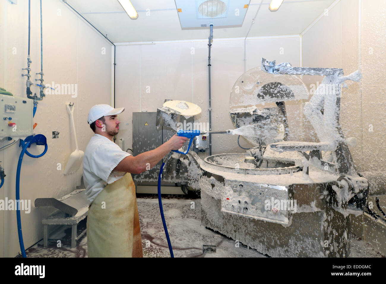 Worker disinfecting interior of a butchery Stock Photo - Alamy