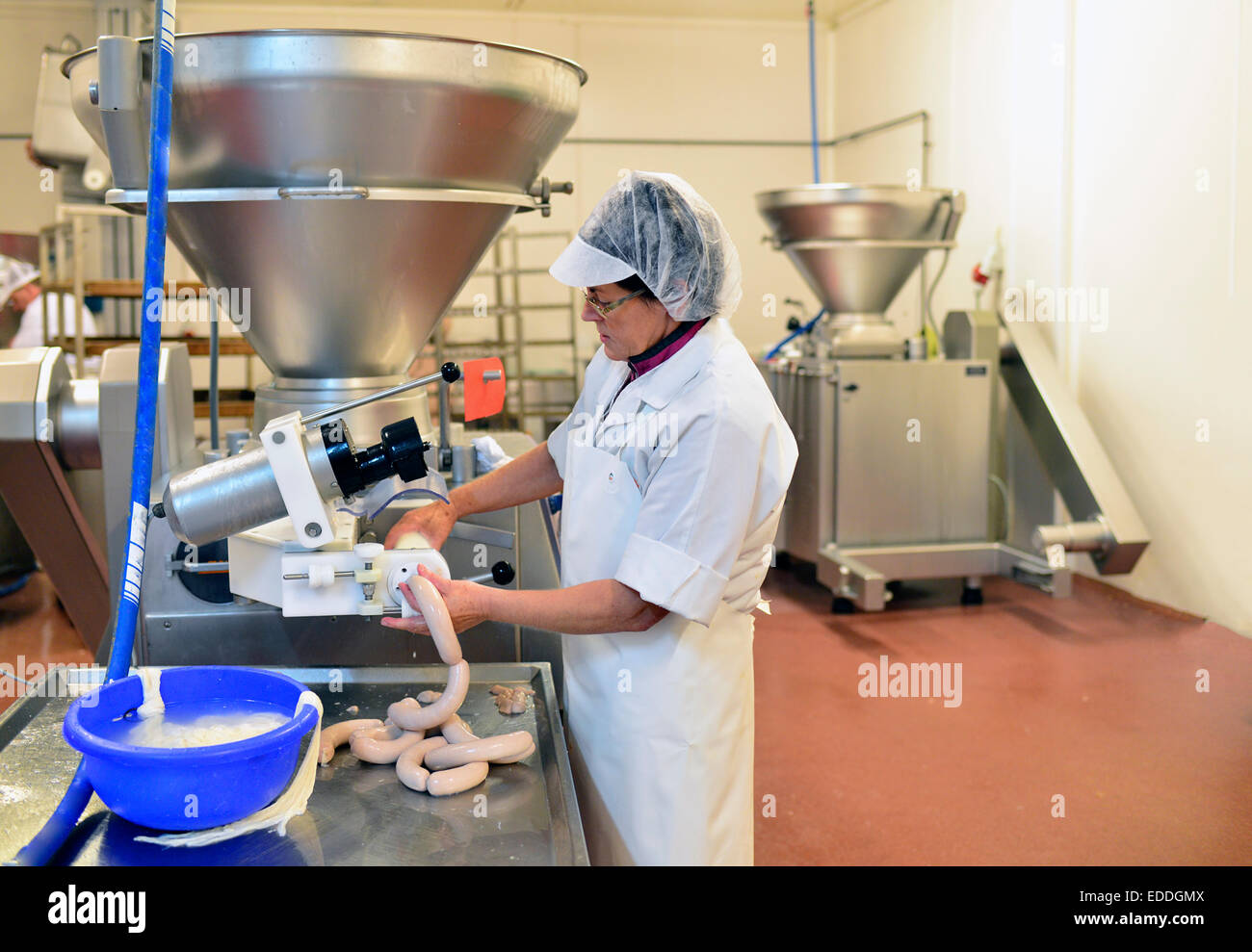 Woman in butchery processing hi-res stock photography and images - Alamy