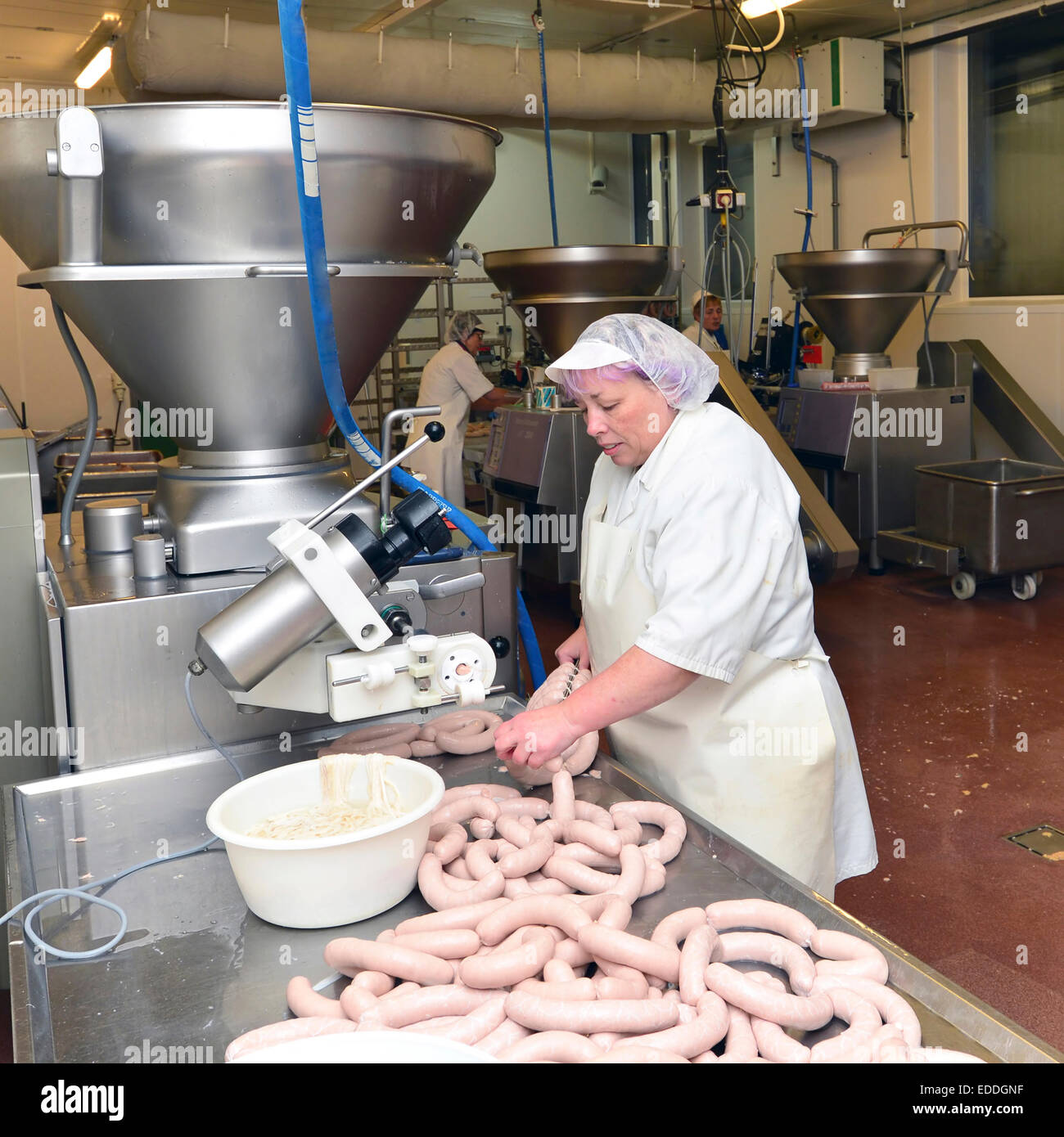 Woman in butchery processing hi-res stock photography and images - Alamy