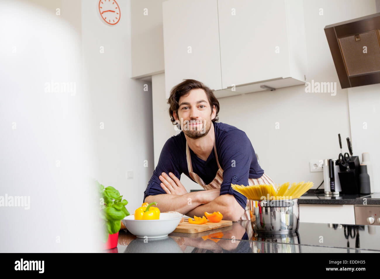 Portrait of smiling man in kitchen Stock Photo - Alamy