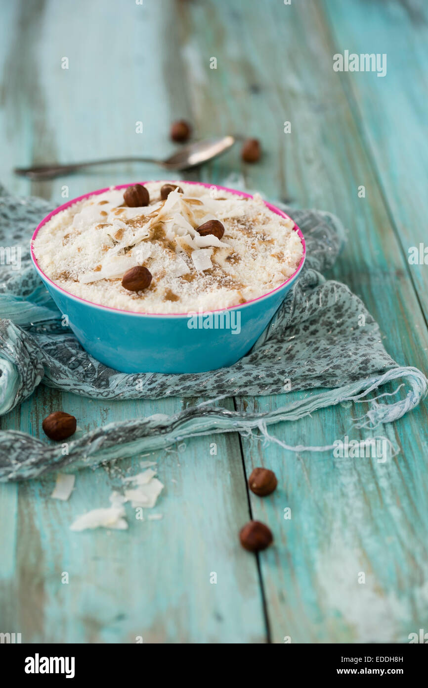 Bowl of coconut ice cream with hazelnut mush and hazelnuts Stock Photo ...