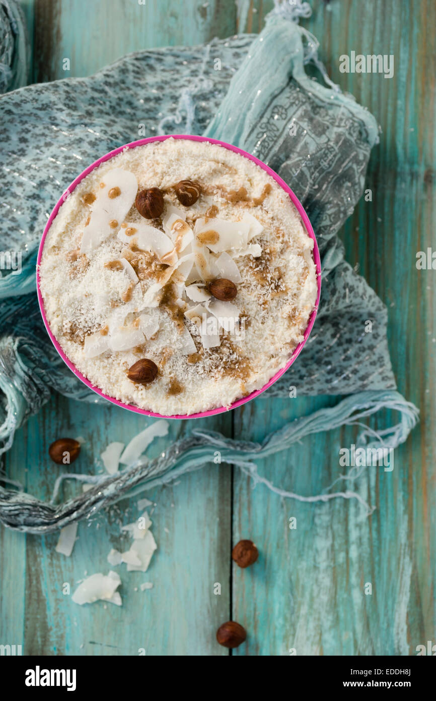 Bowl of coconut ice cream with hazelnut mush and hazelnuts Stock Photo ...