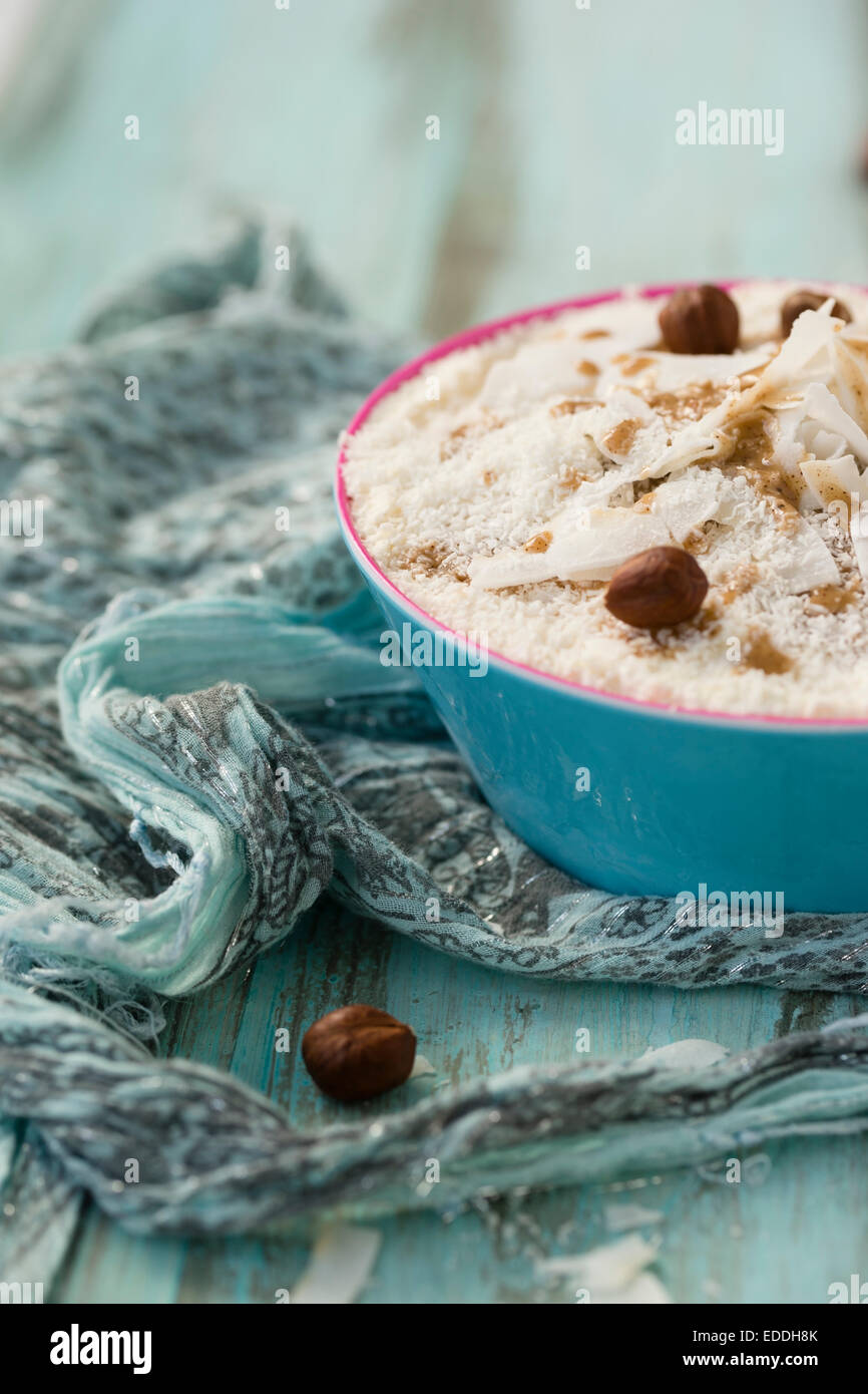 Bowl of coconut ice cream with hazelnut mush and hazelnuts Stock Photo ...