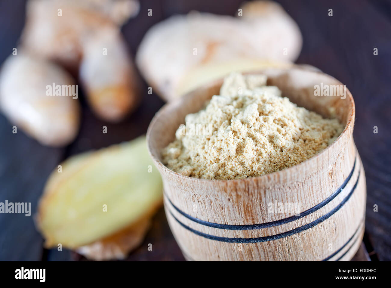 dry ginger in the wooden bowl and on a table Stock Photo - Alamy