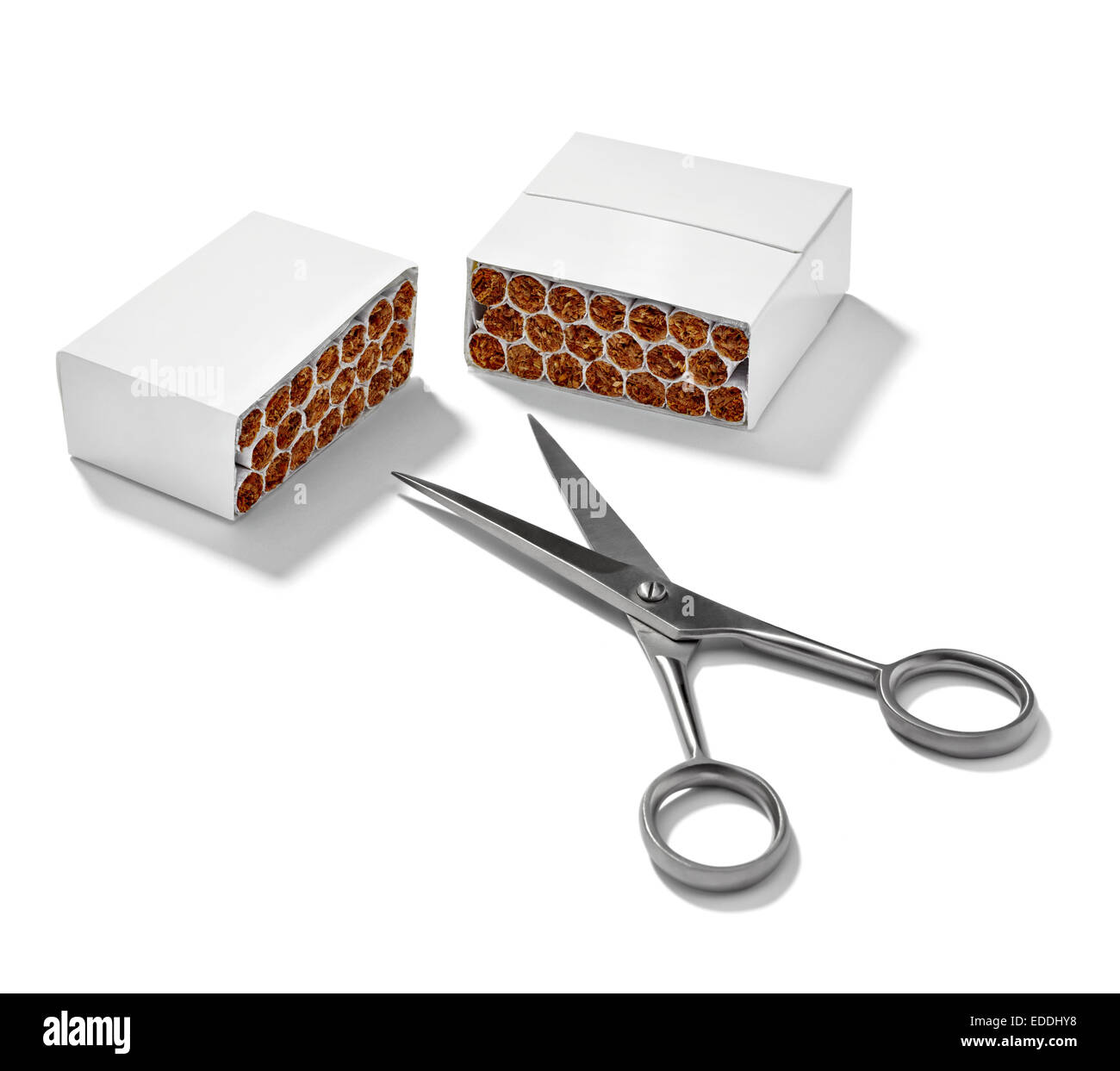 Cut box of cigarettes and scissors on white ground Stock Photo - Alamy