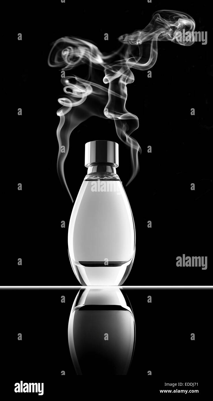 Smoking perfume bottle in front of black background Stock Photo - Alamy