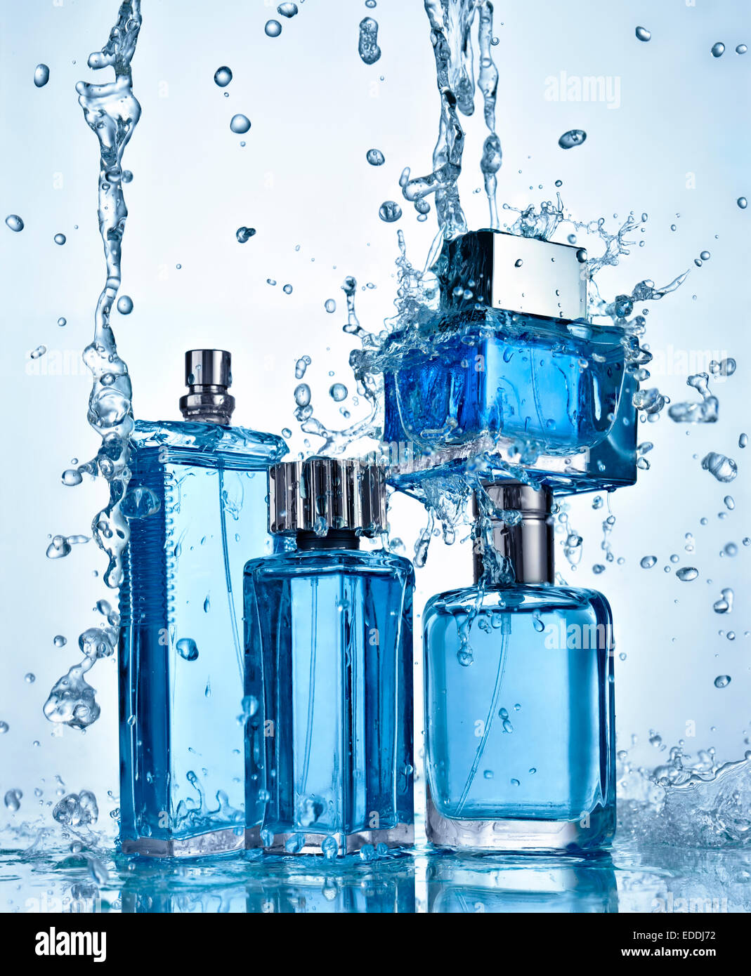 Four perfume bottles under flowing water Stock Photo - Alamy