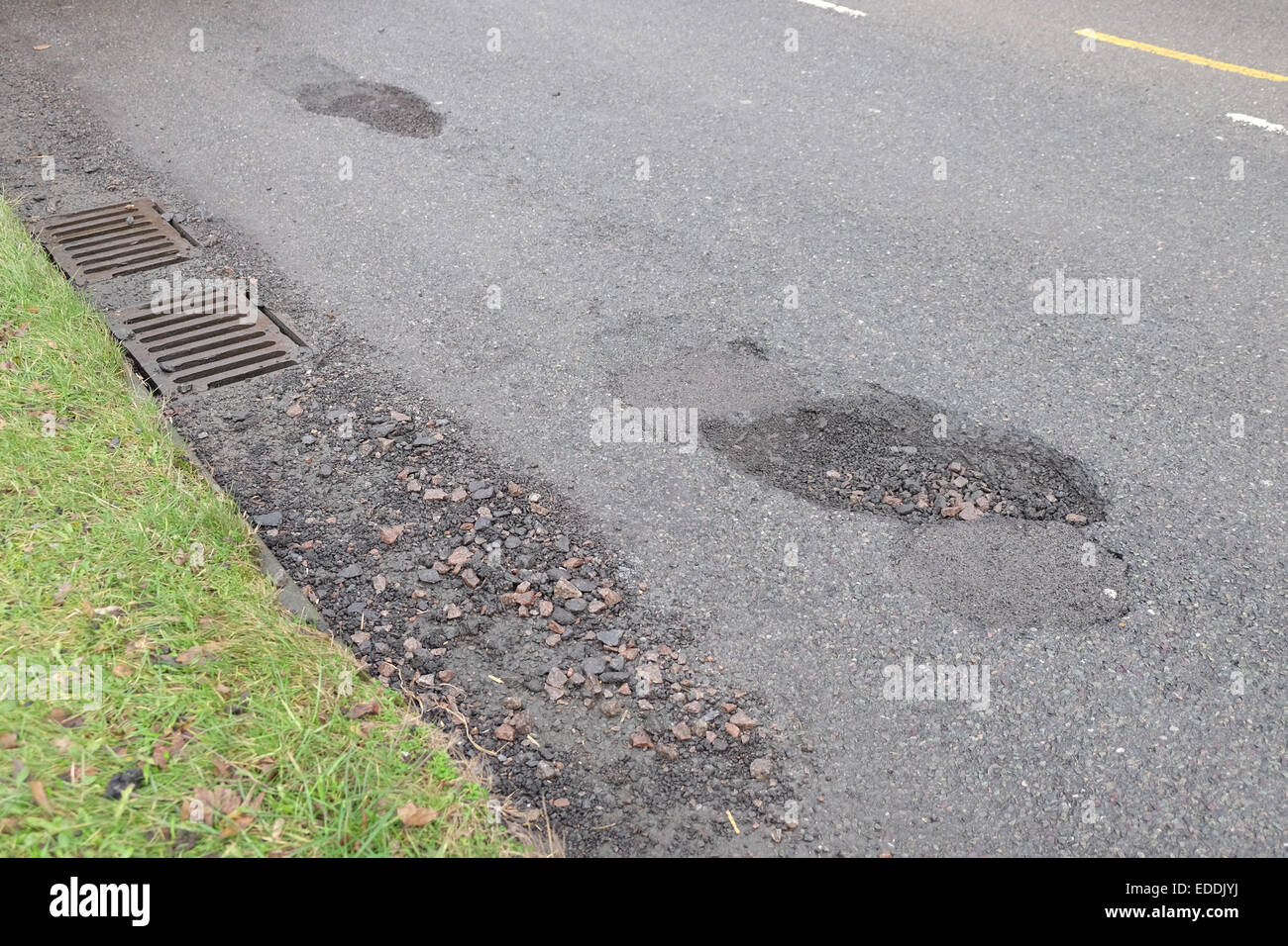 Workmen repair potholes in farley way Stock Photo - Alamy