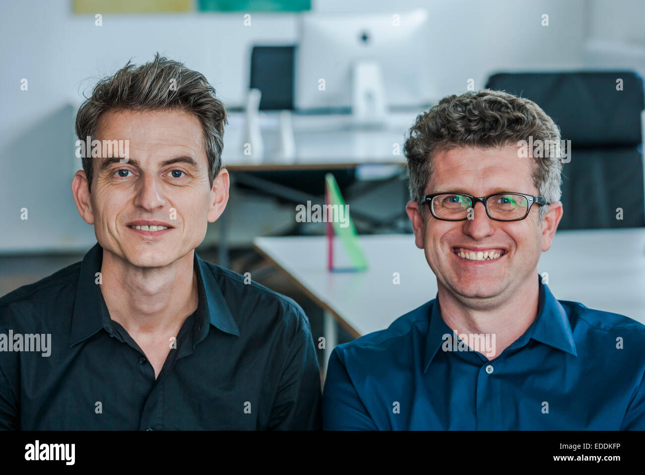 Portrait of two designers in their studio Stock Photo - Alamy