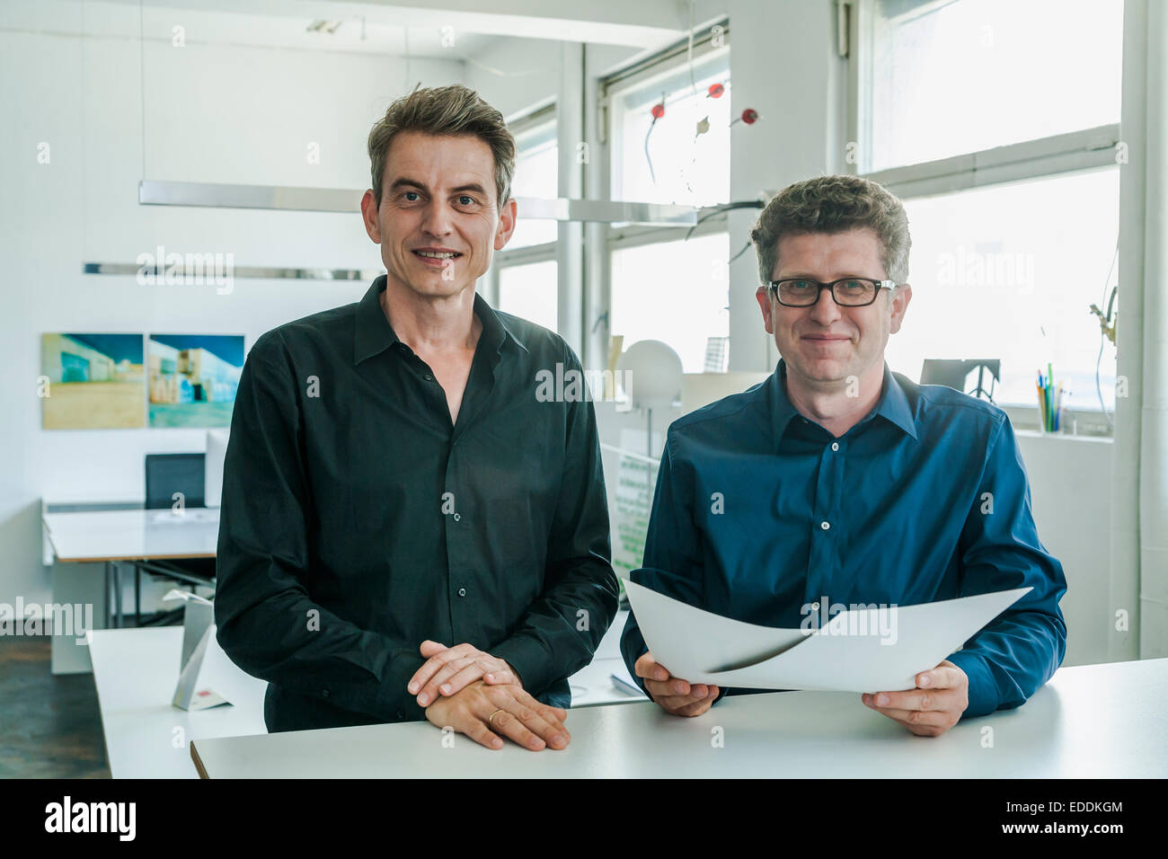 Two designers in their studio with workpiece Stock Photo - Alamy