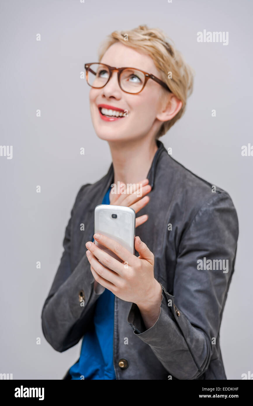 Blond woman on smartphone hand hi-res stock photography and images - Alamy