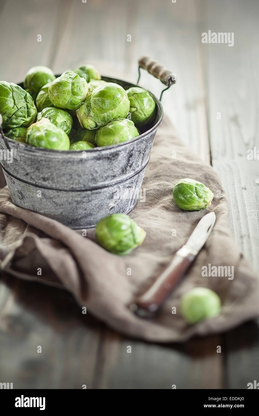 Peeled brussel sprouts in tin bucket, knife, studio Stock Photo - Alamy