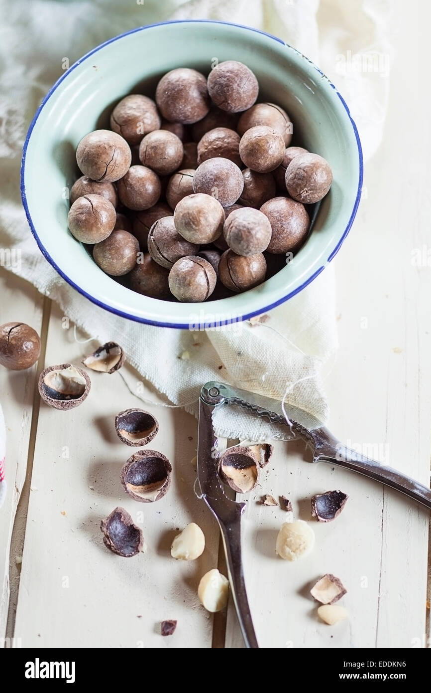 Roasted and salted macadamia nuts in shells, studio Stock Photo - Alamy