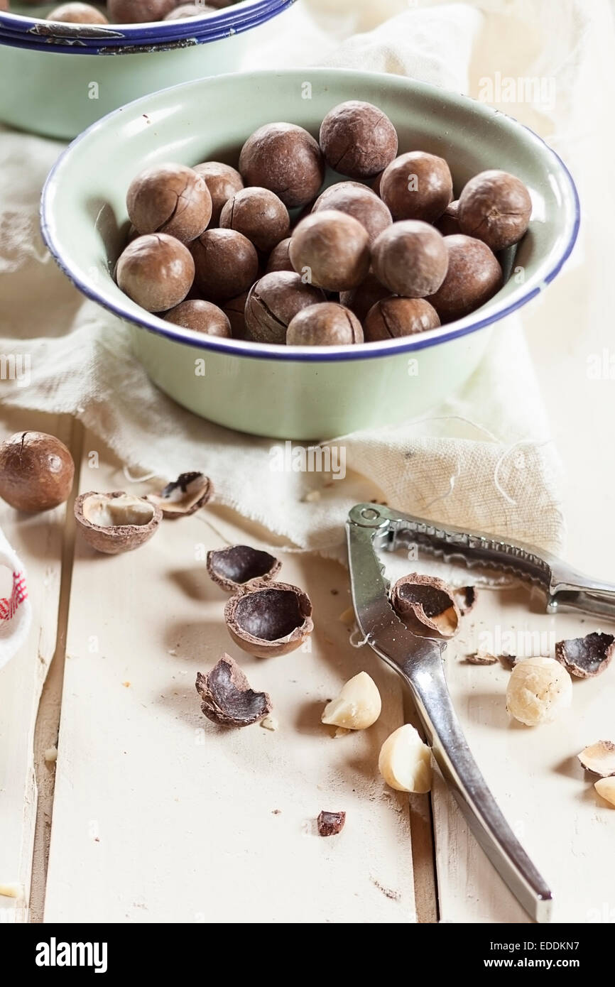 Roasted and salted macadamia nuts in shells, studio Stock Photo - Alamy