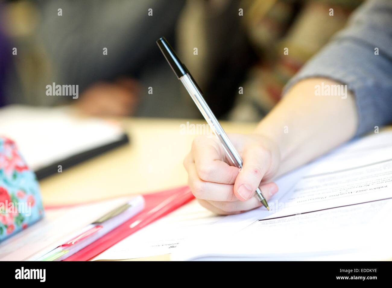 Student University girl writing in close up using black biro Stock ...