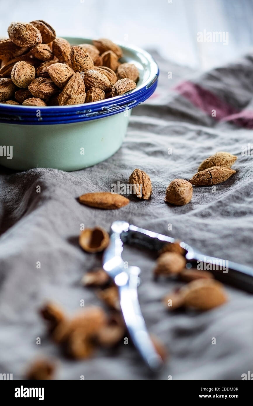 Roasted and salted almonds in shells, studio Stock Photo - Alamy