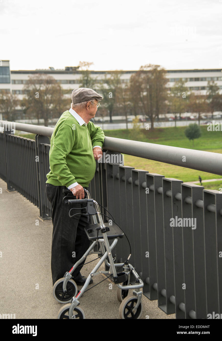 Senior man with wheeled walker on bridge Stock Photo - Alamy