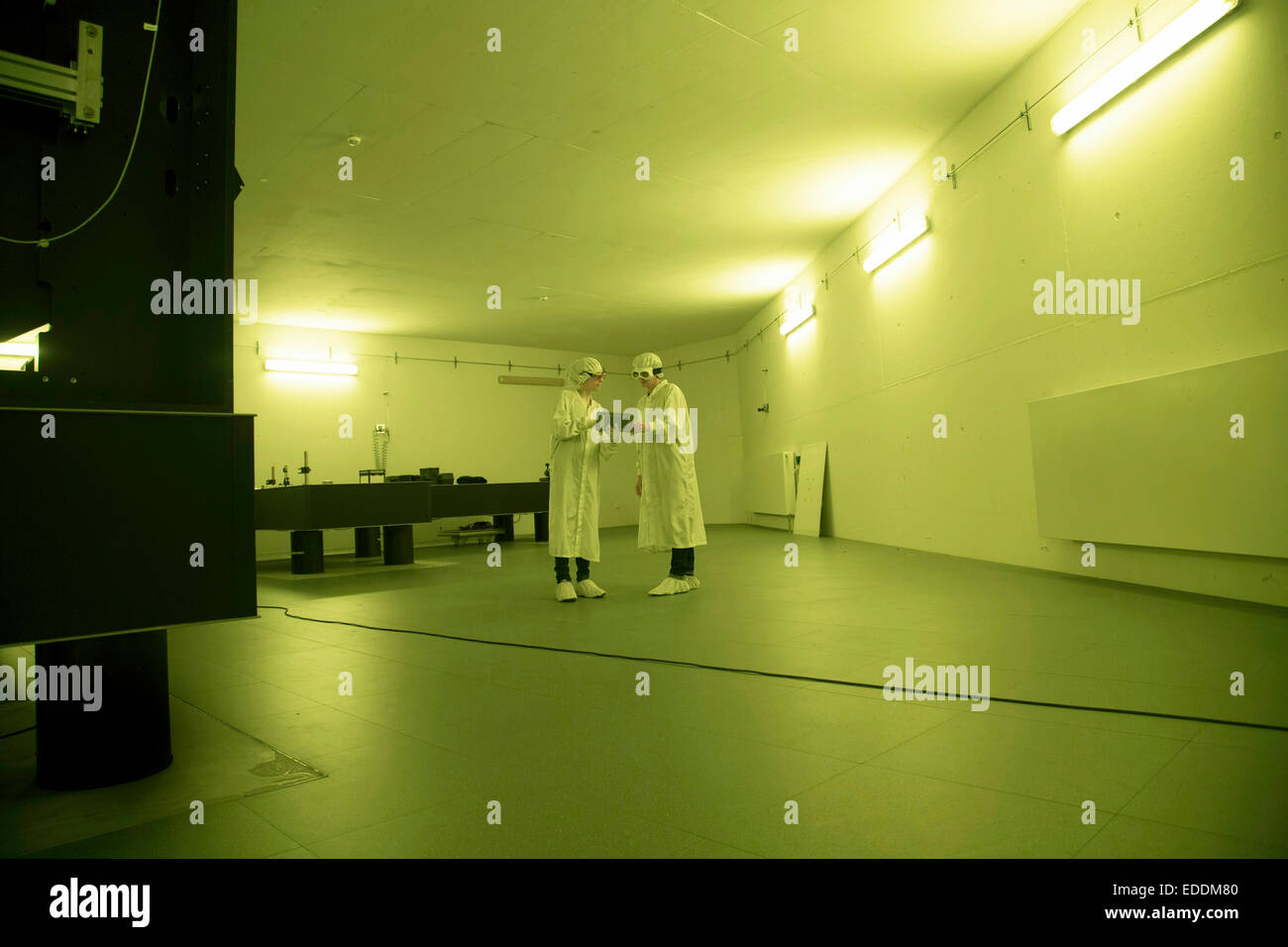 Germany, Female technicians working in optical clean room unit Stock ...