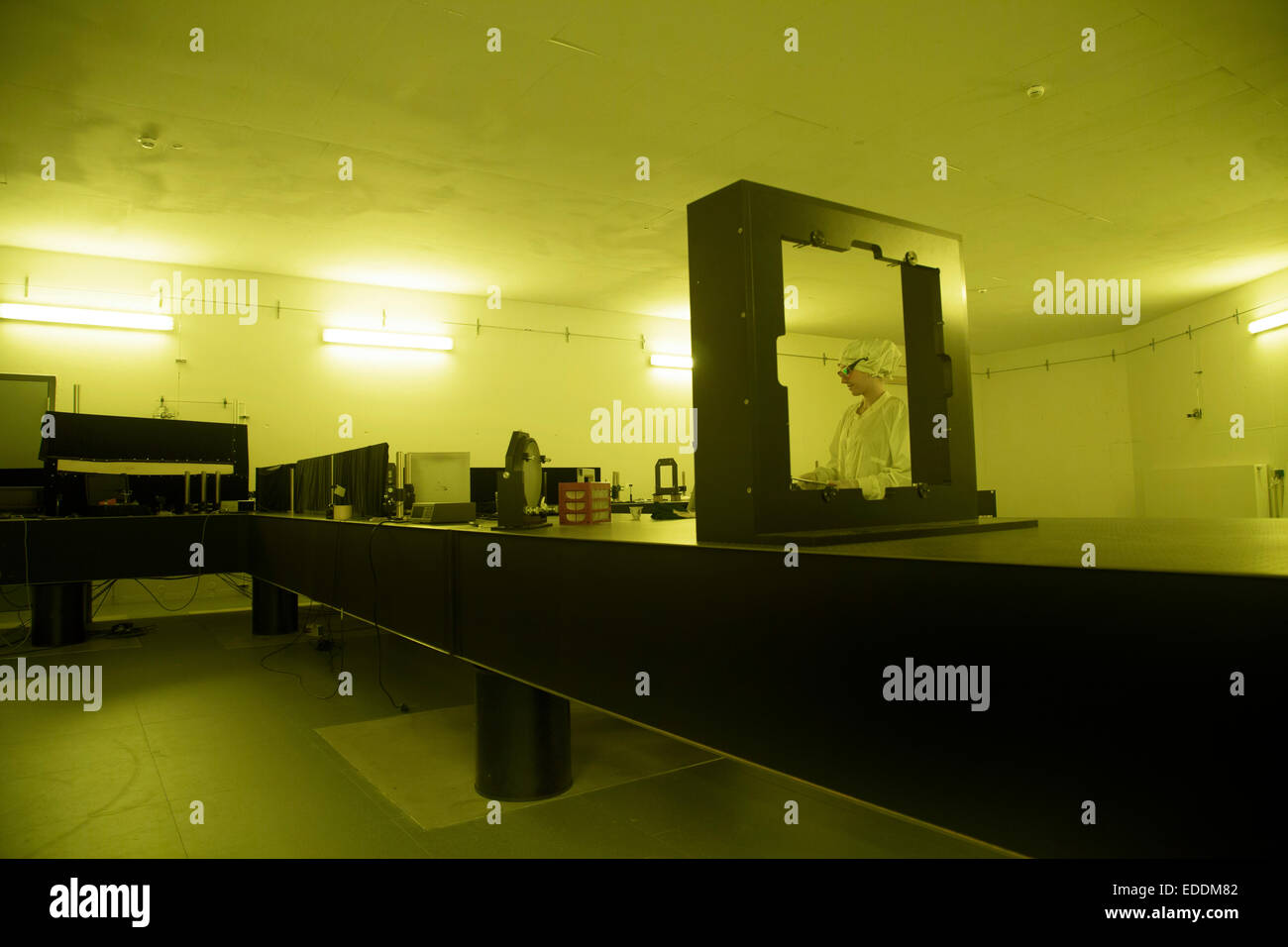 Germany, Female technician working in optical clean room unit Stock ...