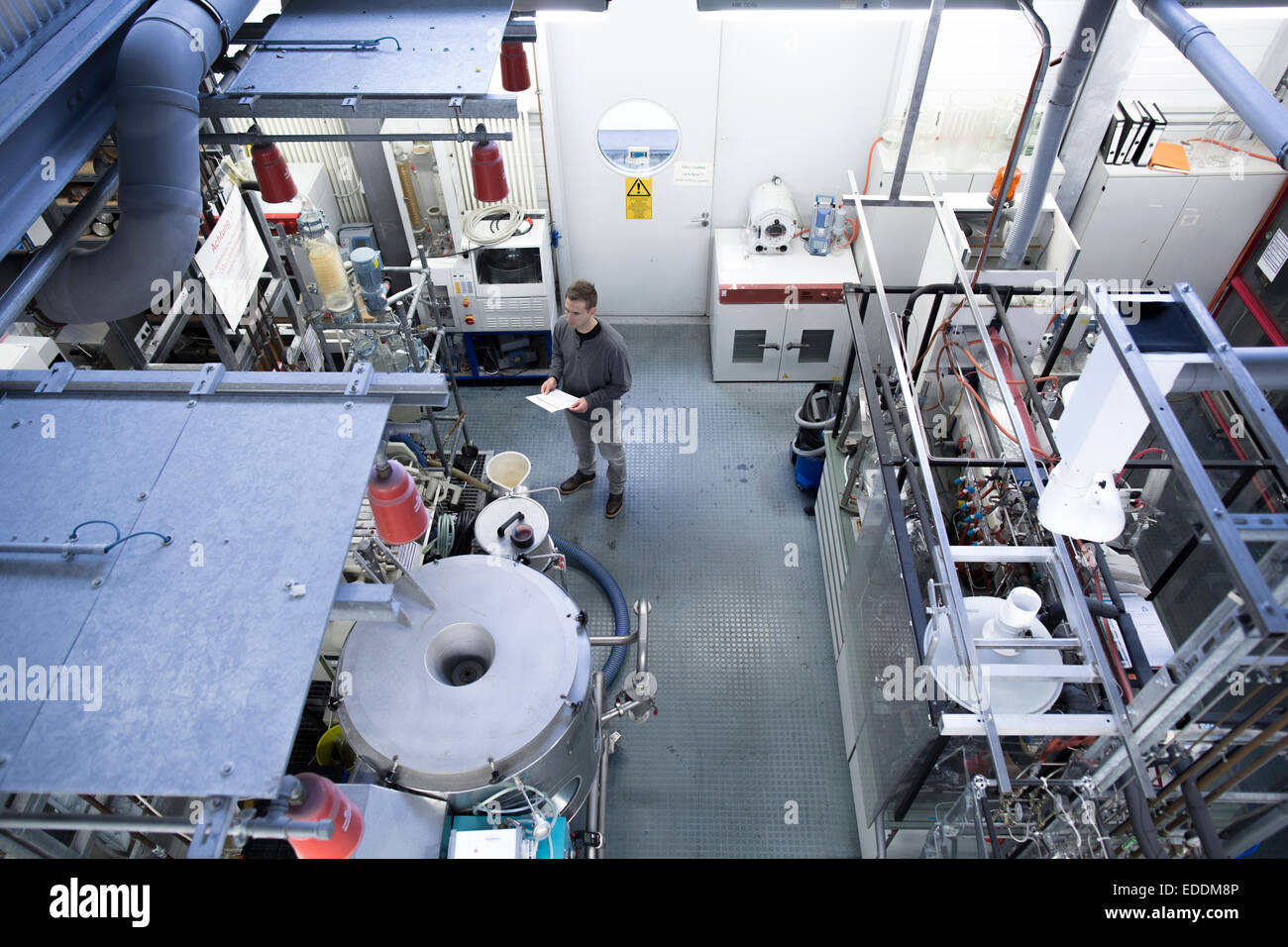 Young man in technical room Stock Photo - Alamy