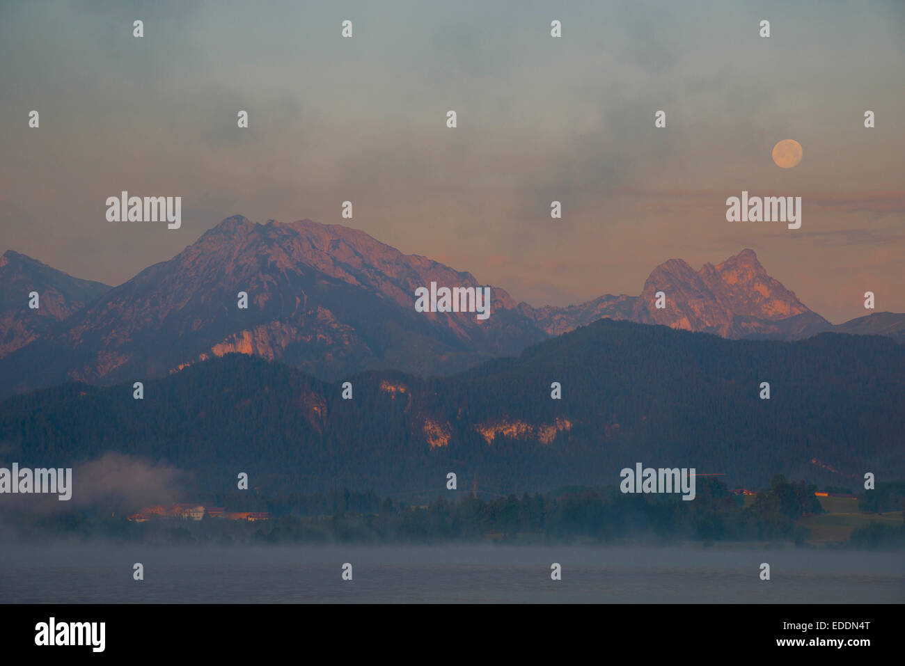 Germany, Bavaria, Fuessen, morning light at full moon at Hopfensee ...